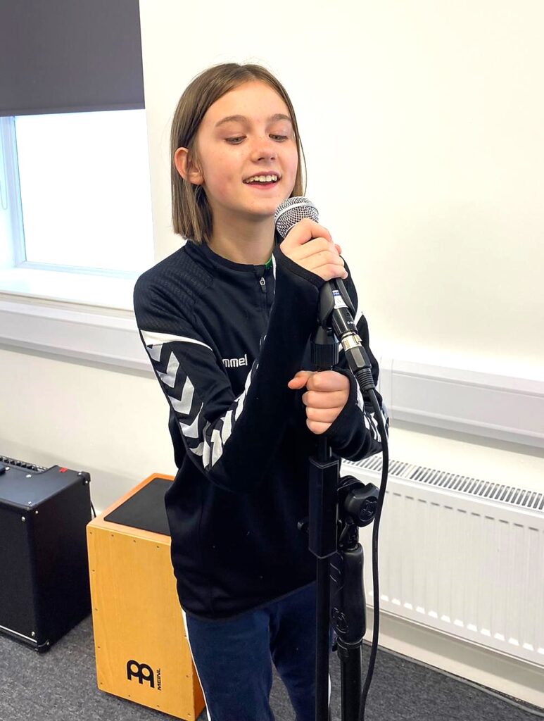Maisie sparkles at singing lessons with acclaimed Wrexham Sounds music ...